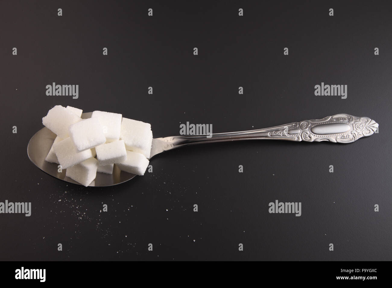big or super size spoon with pile of cube white sugar Stock Photo - Alamy