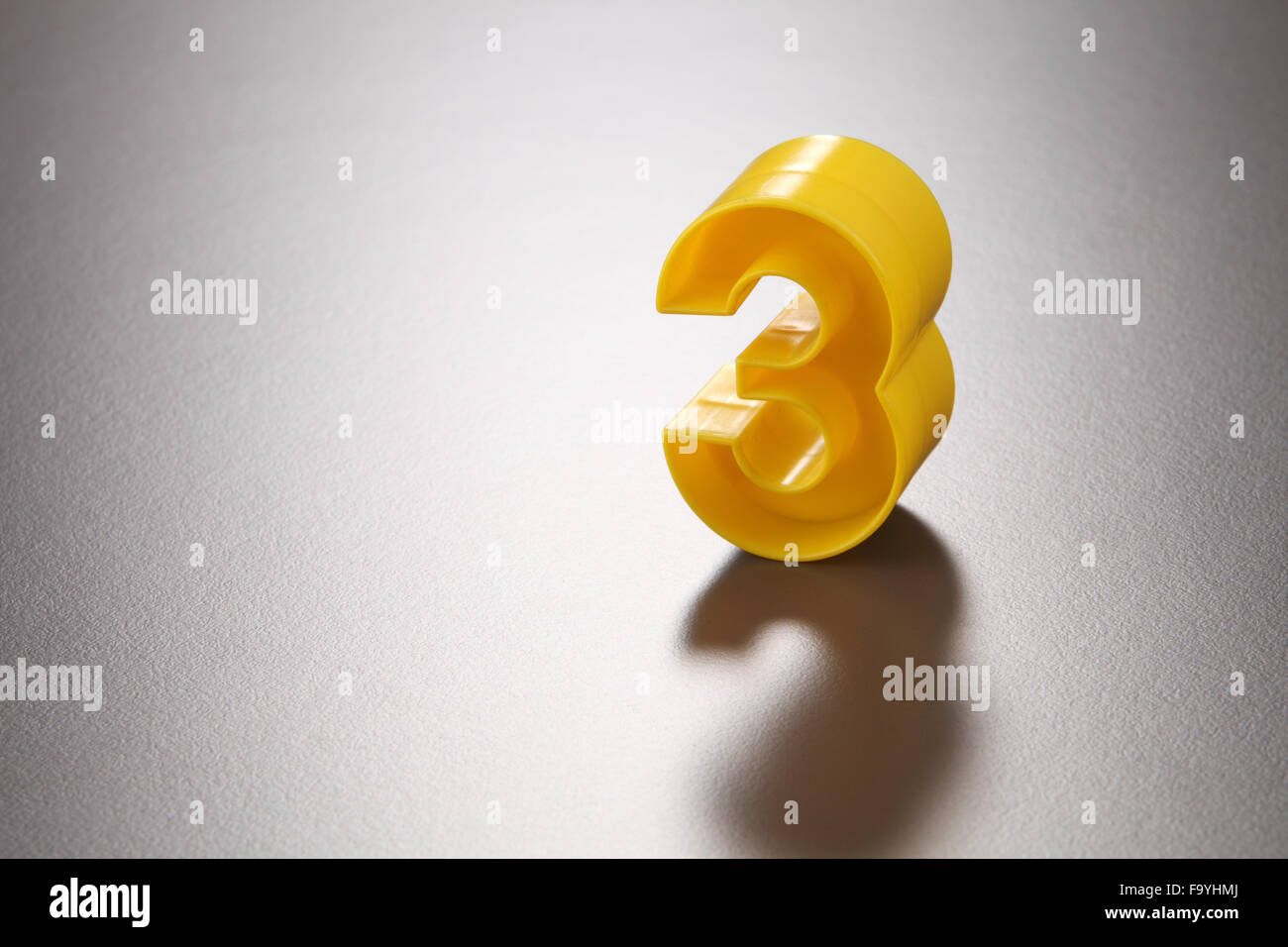 number three on the gray background Stock Photo - Alamy