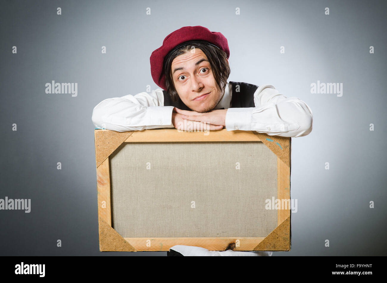 Funny artist in dark studio Stock Photo - Alamy