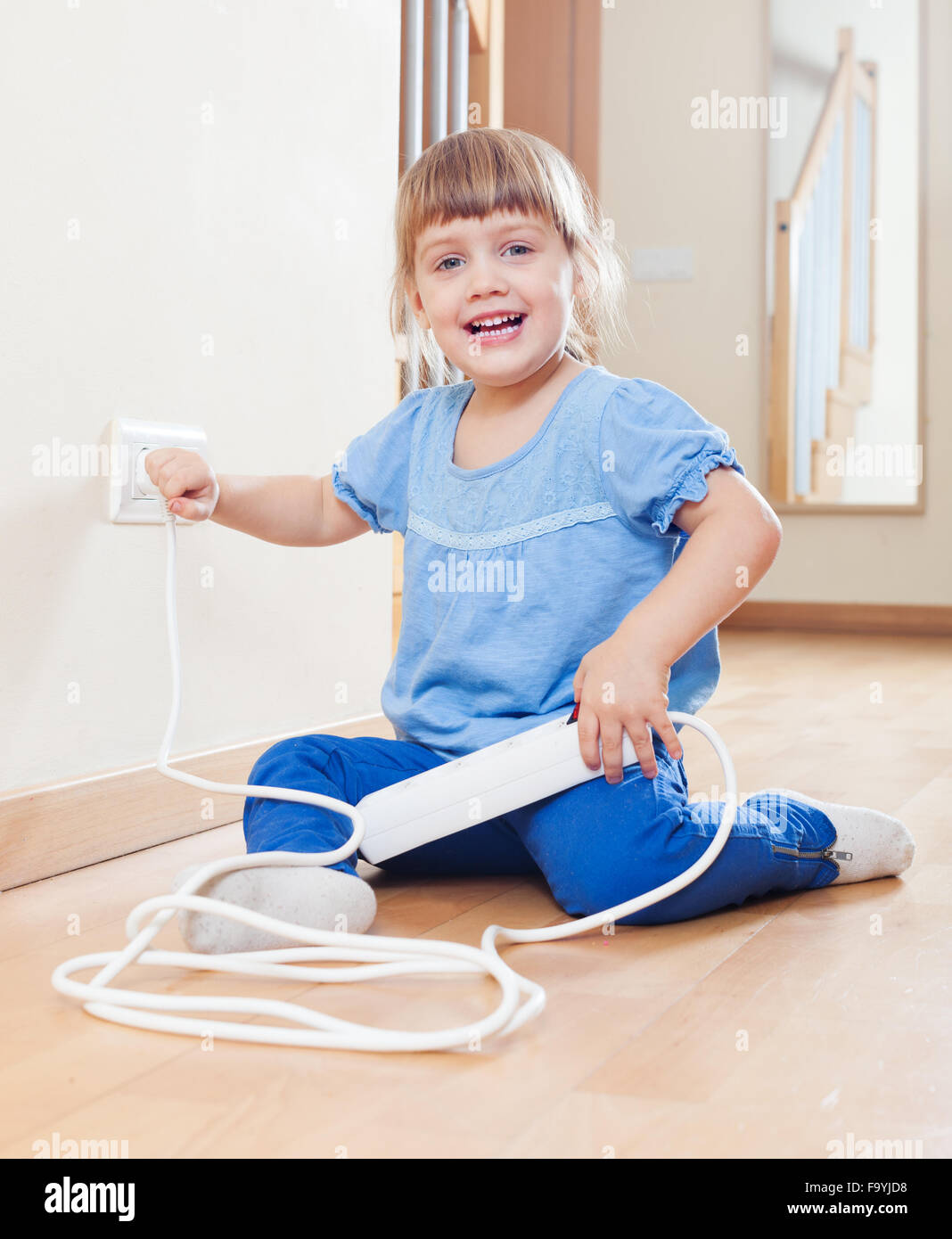 three year old child playing with electricity Stock Photo - Alamy