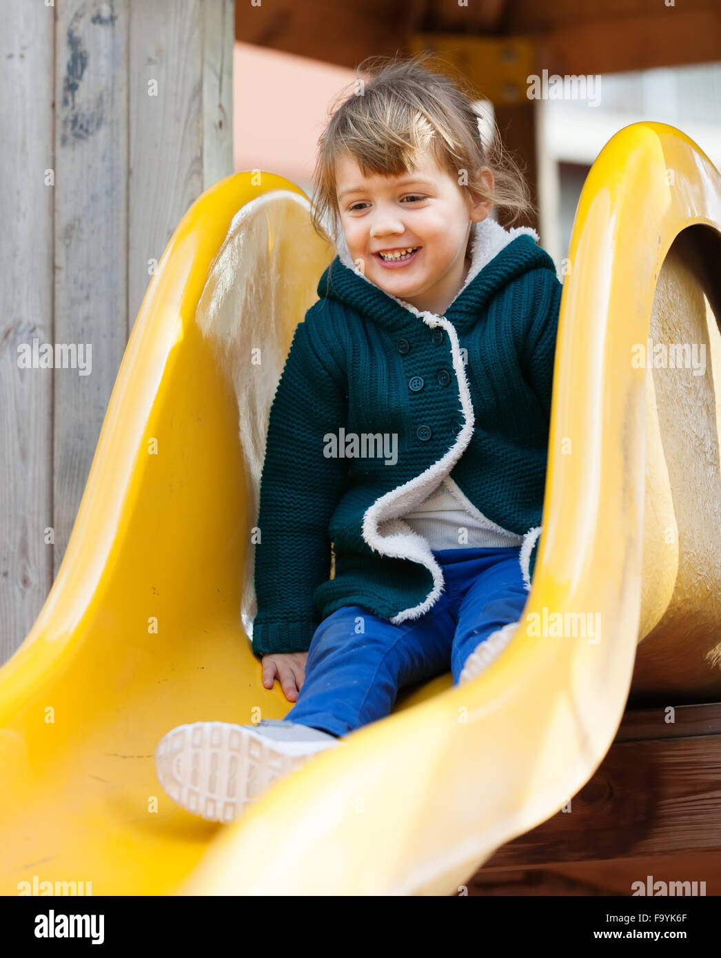 happy child on slide at playground in autumn Stock Photo - Alamy