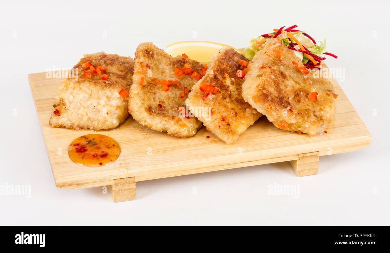 Fried fish fillets with salad Stock Photo - Alamy