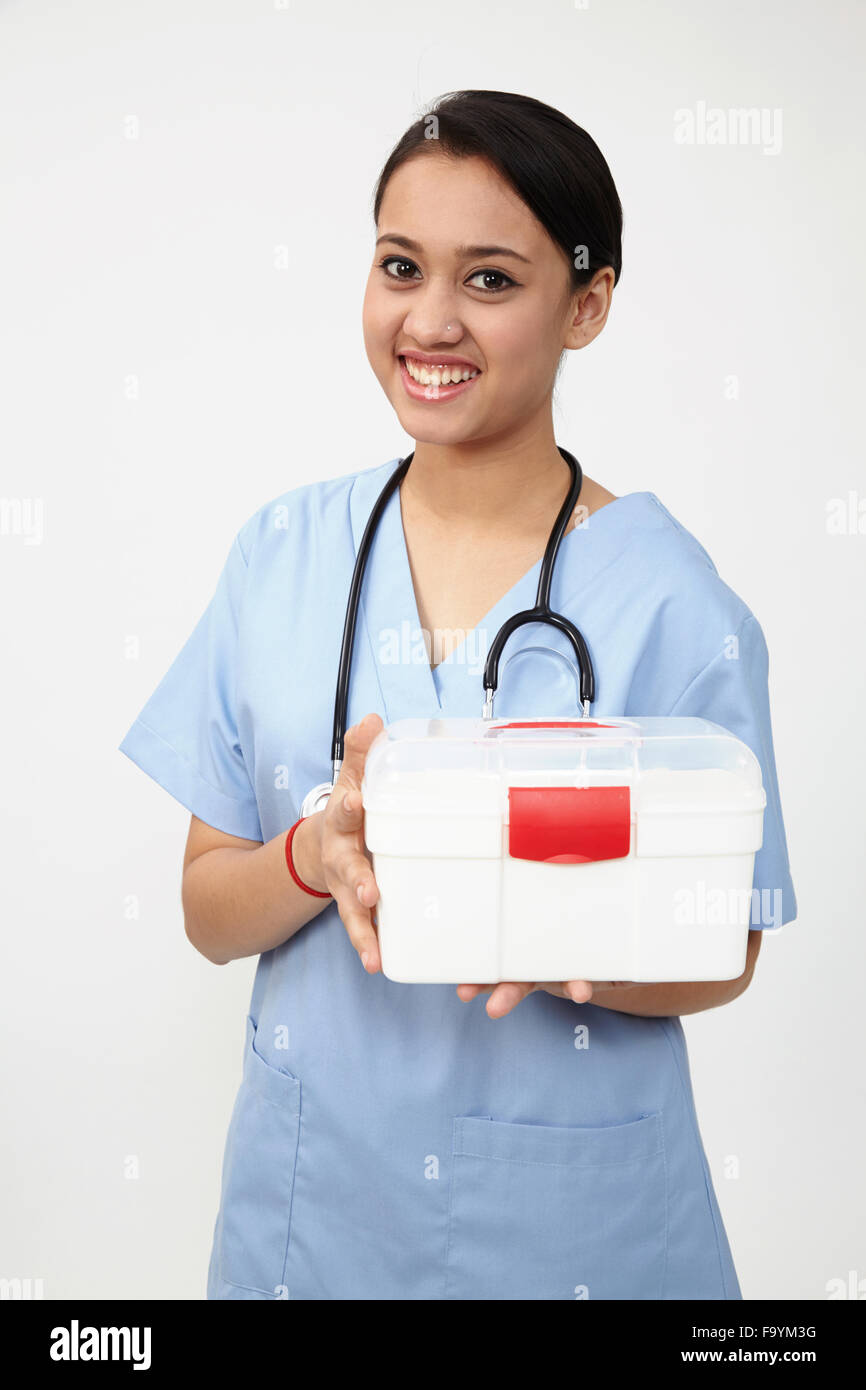 female nurse or doctor carrying a portable first aid kit isolated on ...