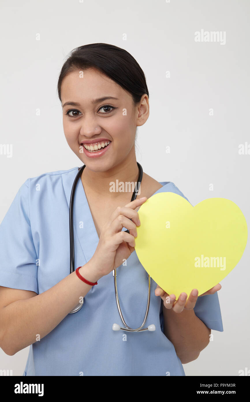 Close up of the nurse holding heart shape Stock Photo - Alamy