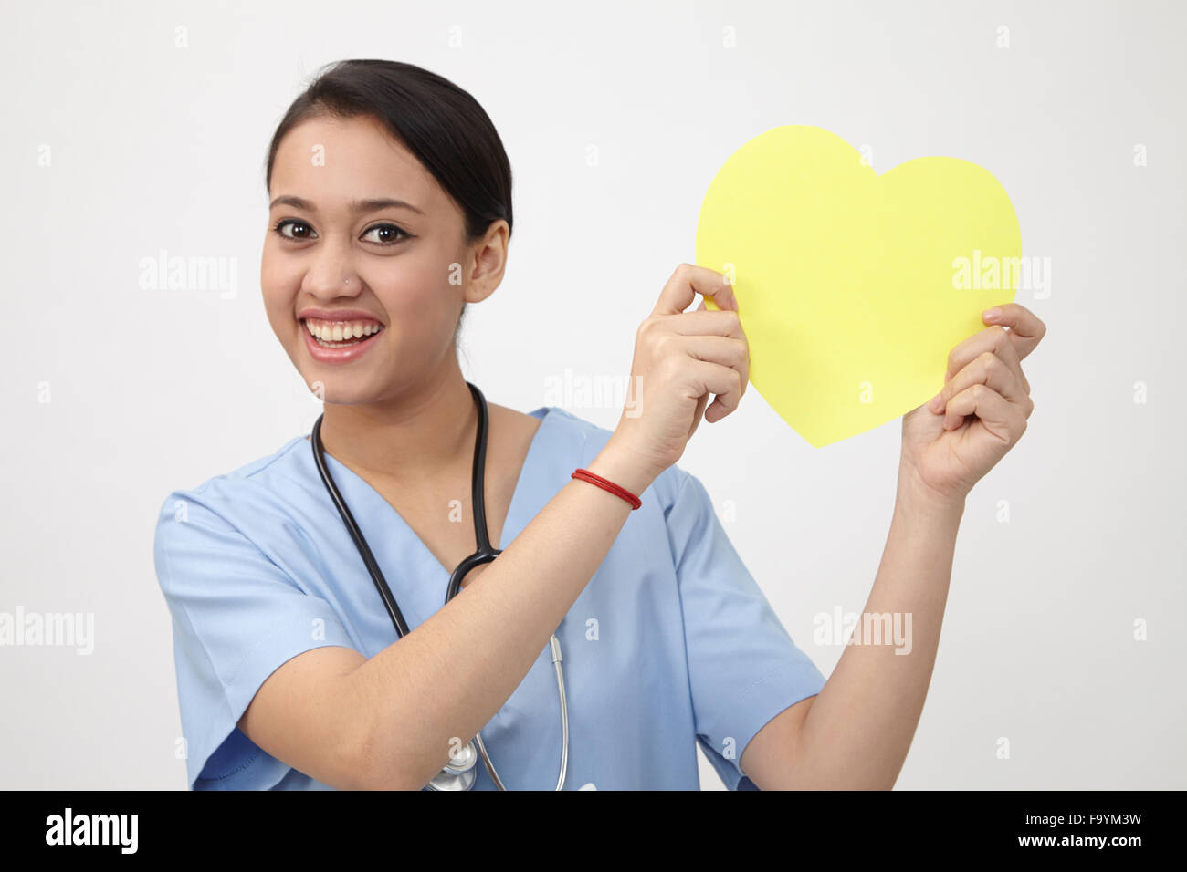 Close up of the nurse holding heart shape Stock Photo - Alamy