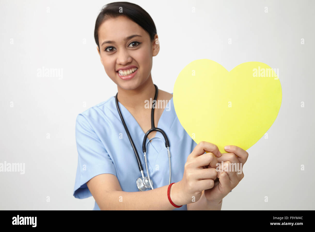Close up of the nurse holding heart shape Stock Photo - Alamy