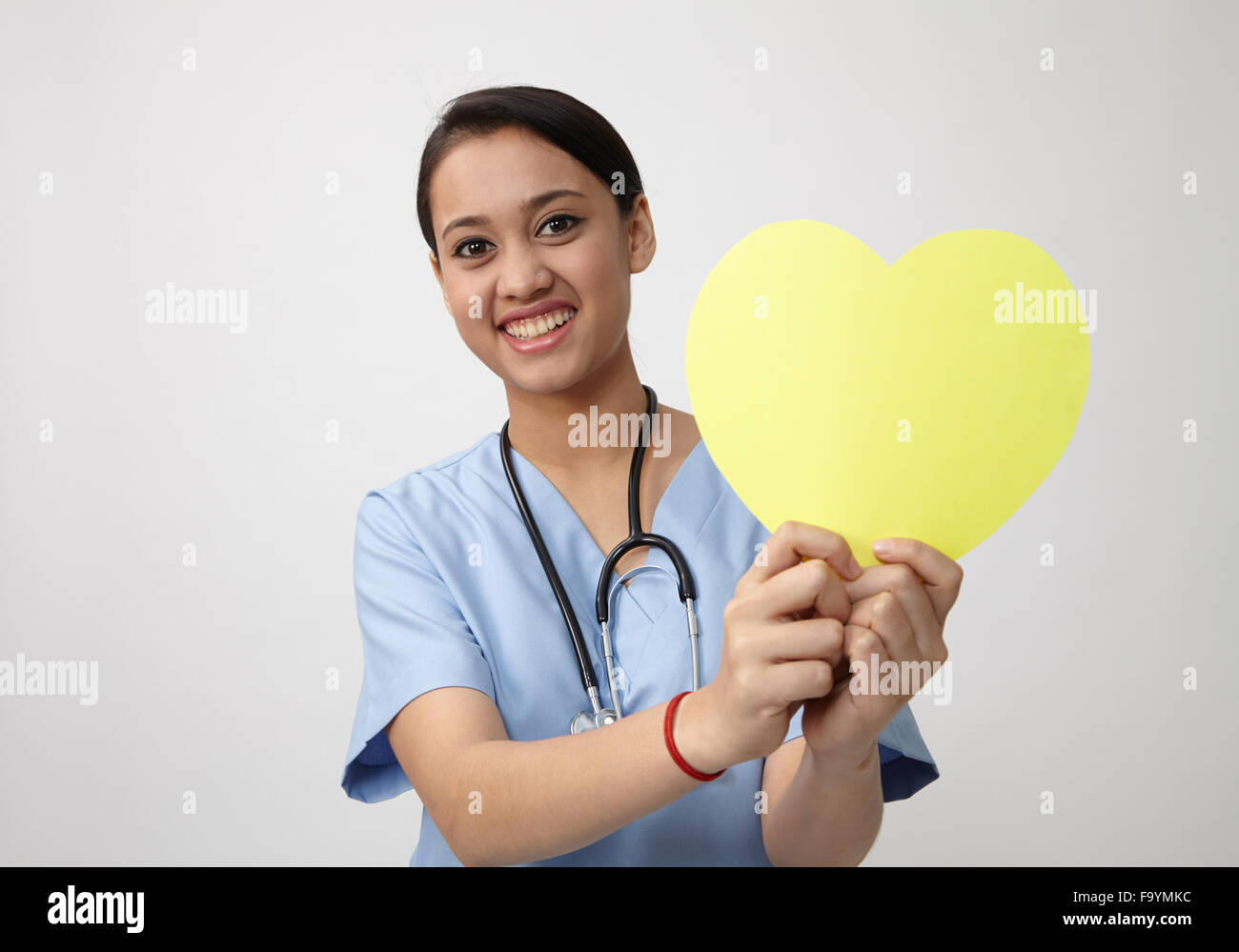 Close up of the nurse holding heart shape Stock Photo - Alamy