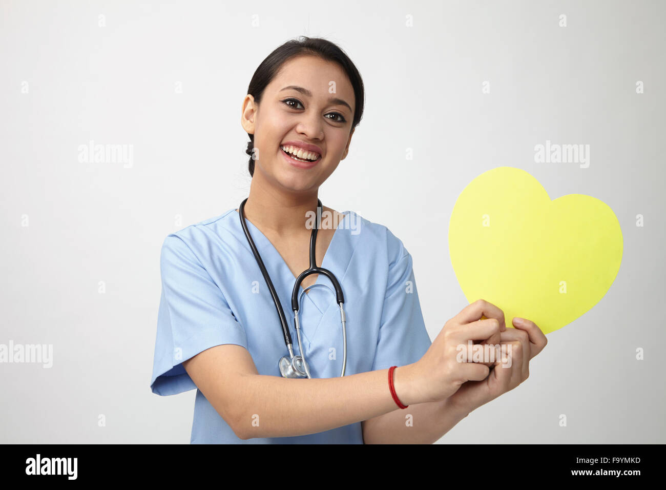 Close up of the nurse holding heart shape Stock Photo - Alamy
