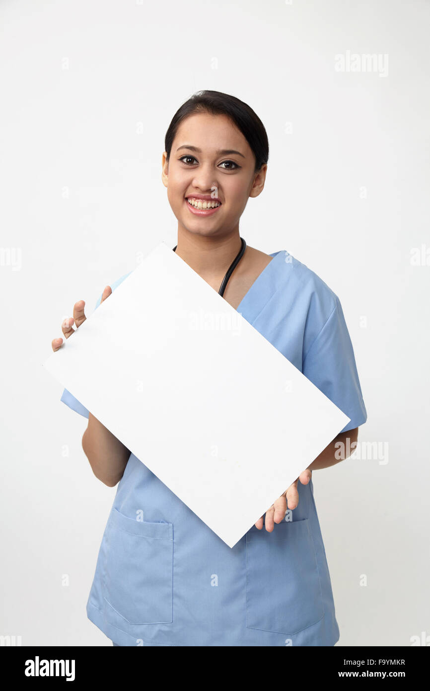 Nurse showing medical sign billboard standing, Young smiling woman ...
