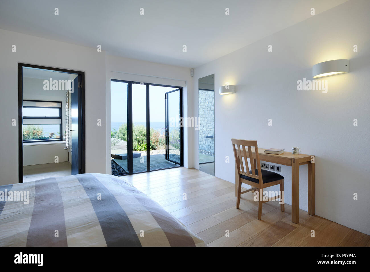 The interior spaces of a modern house on the cliffs overlooking the sea ...