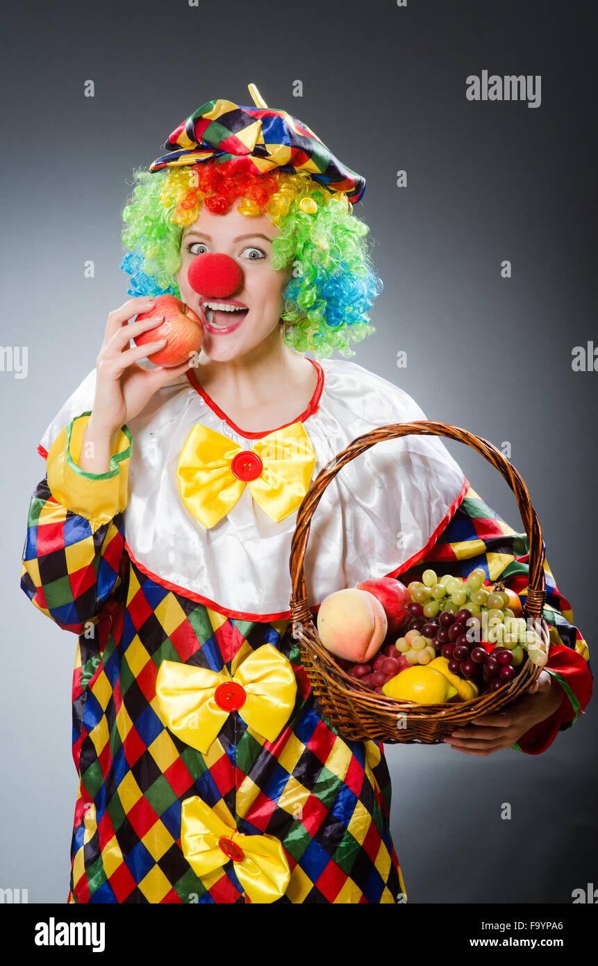 Clown with fruits in funny concept Stock Photo - Alamy