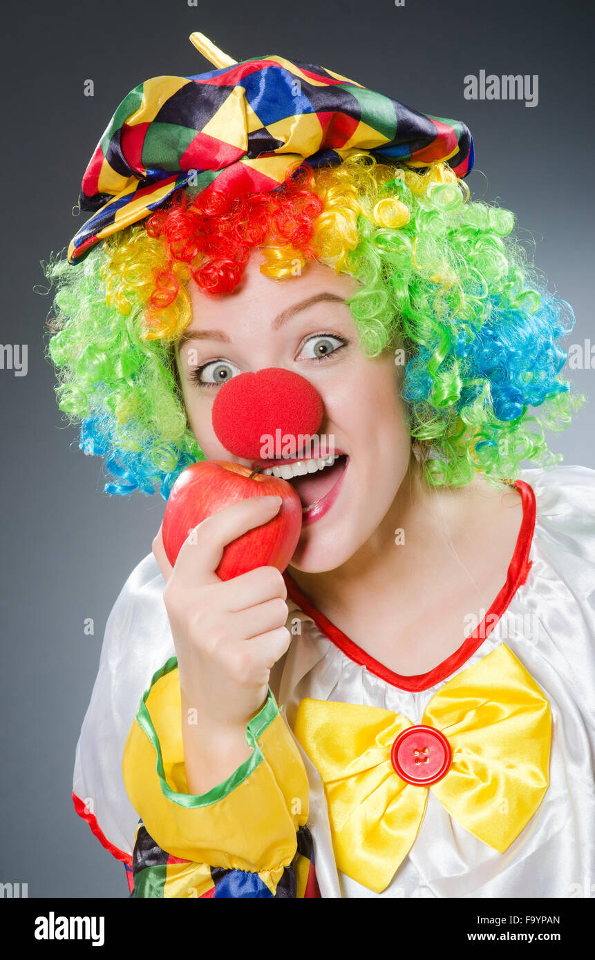 Clown with fruits in funny concept Stock Photo - Alamy