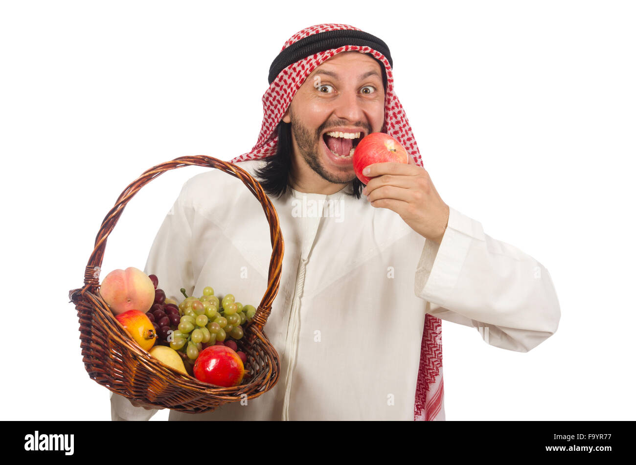 Arab man with fruits isolated on white Stock Photo - Alamy