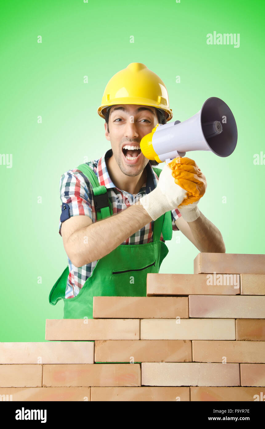 Builder with hard hat on white Stock Photo - Alamy