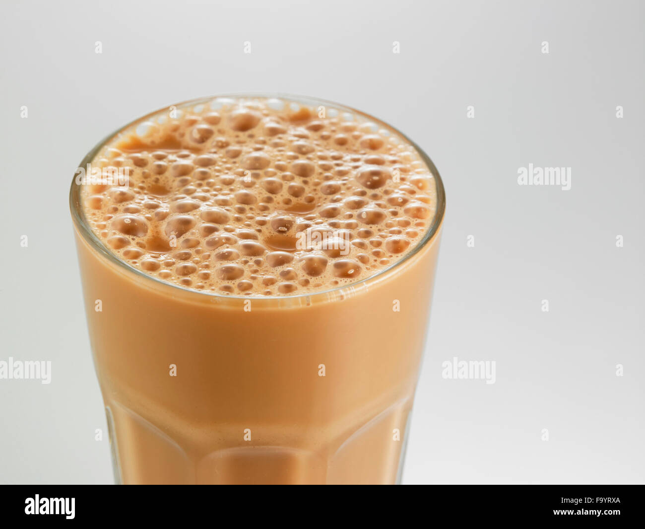 Big glass Tea with milk or Teh Tarik in Malaysia Stock Photo - Alamy