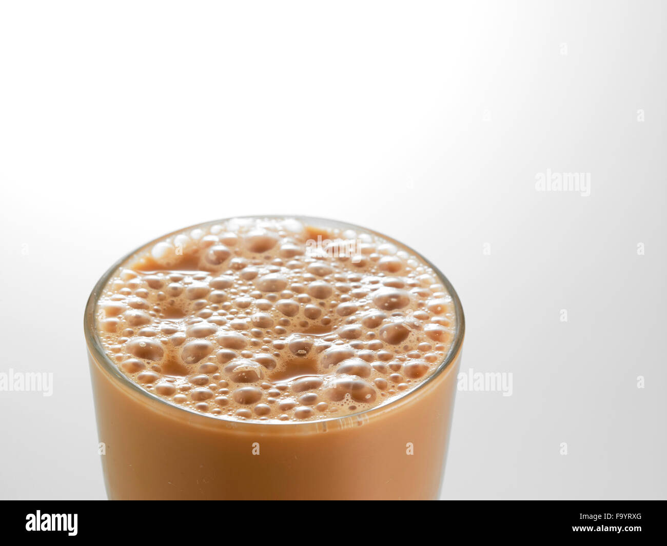 Big glass Tea with milk or Teh Tarik in Malaysia Stock Photo - Alamy