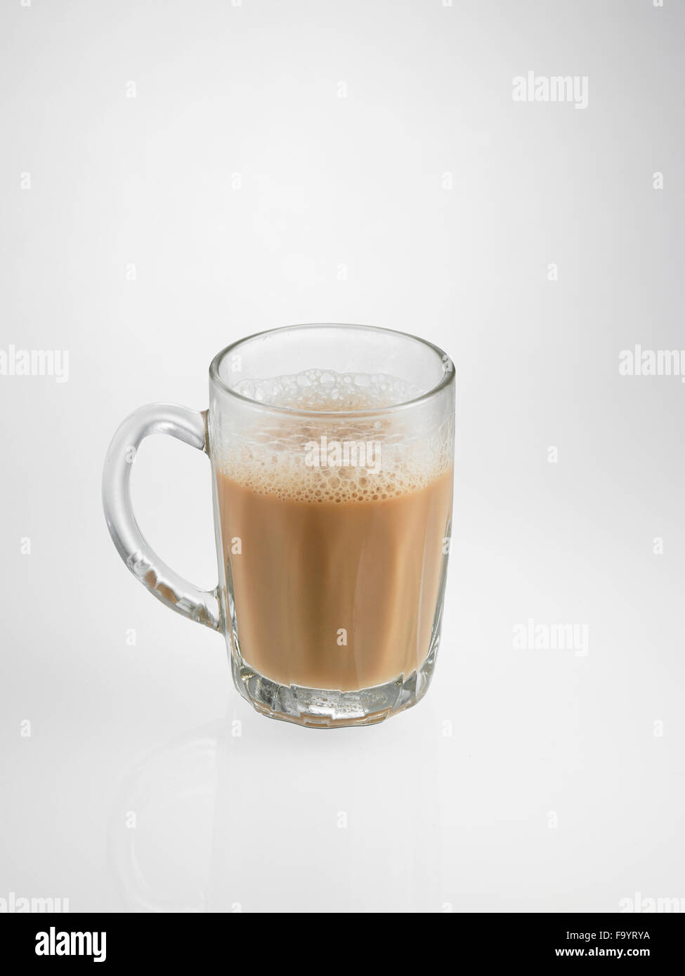Half glass of Tea with milk or Teh Tarik in Malaysia Stock Photo - Alamy