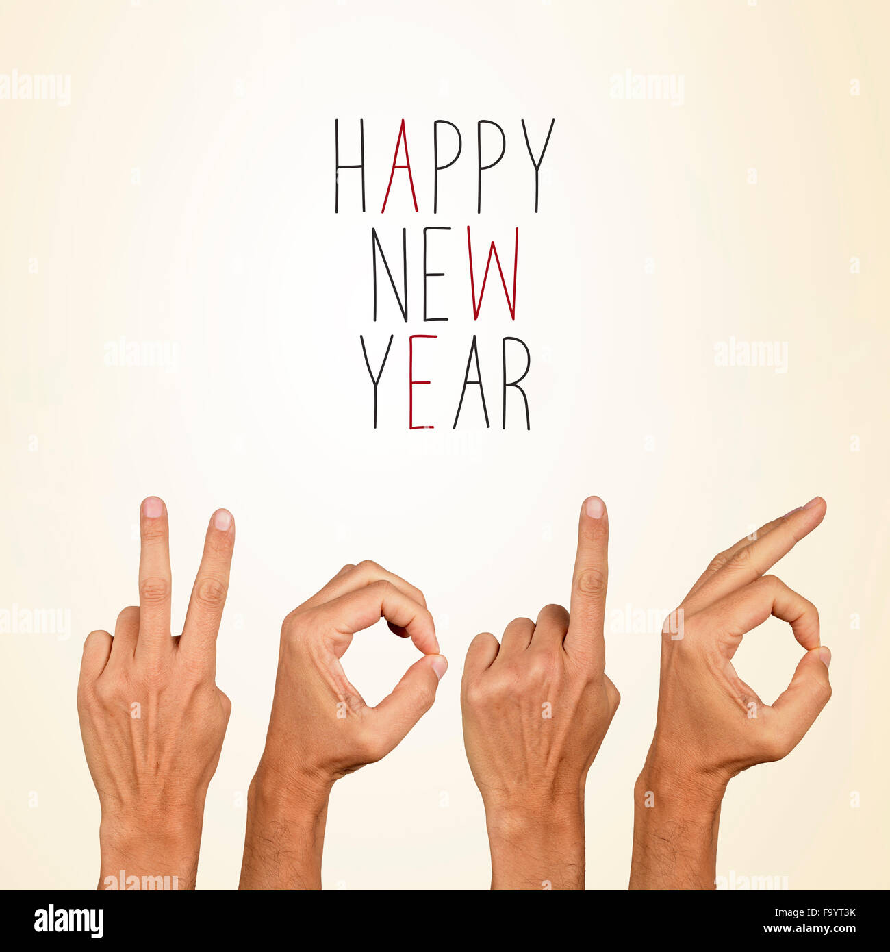 man hands forming the number 2016, as the new year, and the text happy ...