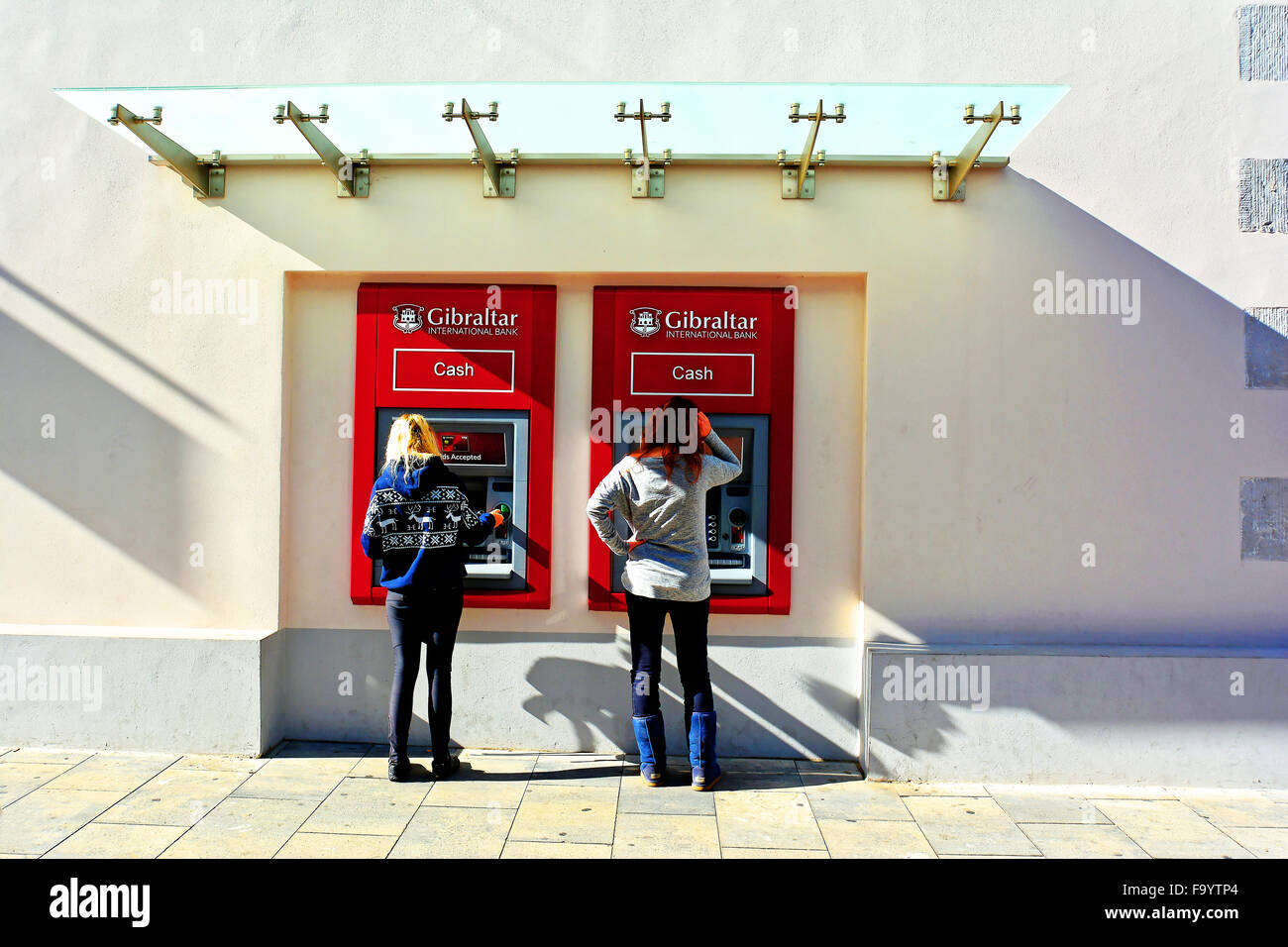 Gibraltar International Bank cash machine users Stock Photo - Alamy