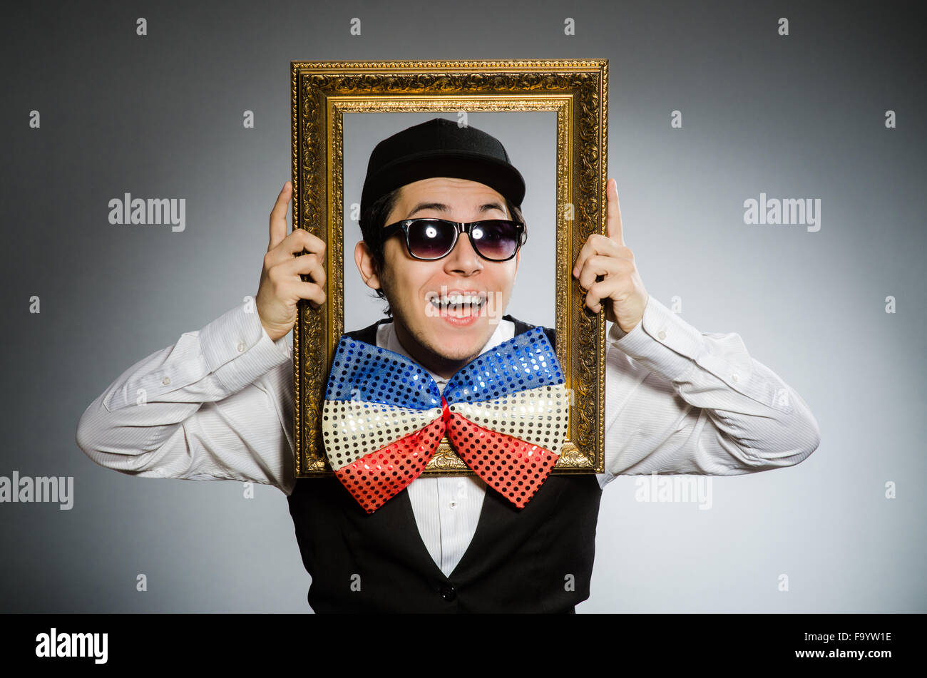 Funny man with picture frame Stock Photo - Alamy
