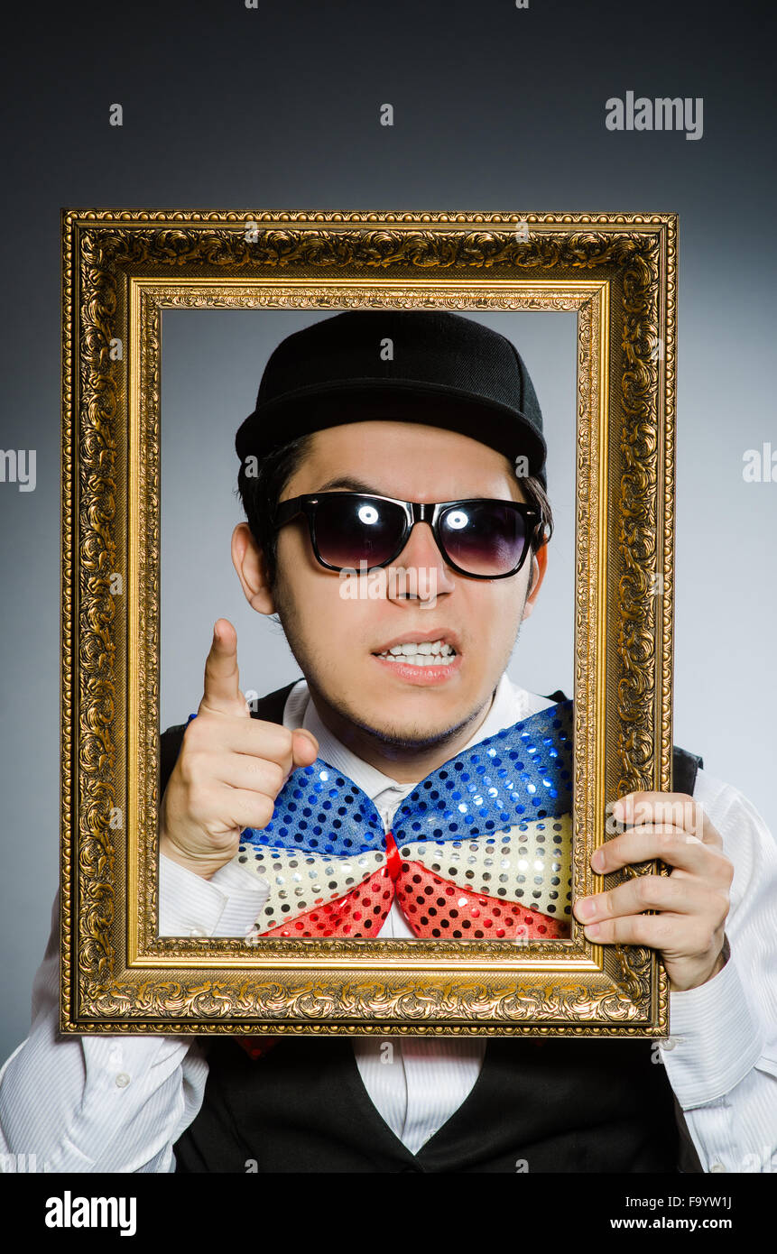 Funny man with picture frame Stock Photo - Alamy