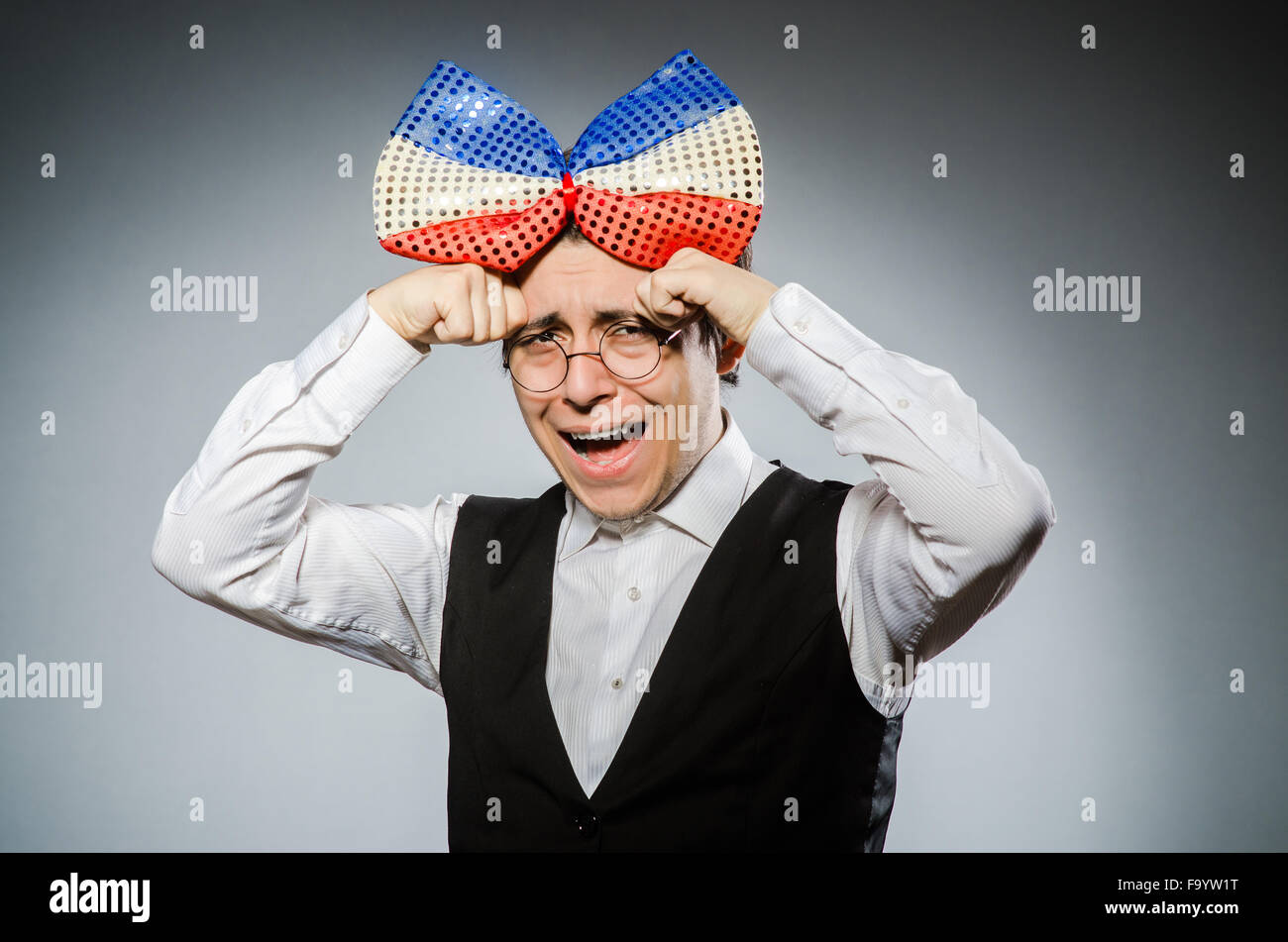 Funny man with giant bow tie Stock Photo - Alamy