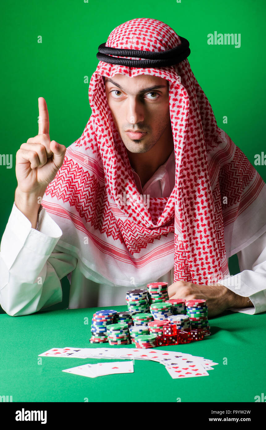 Arab man playing in the casino Stock Photo - Alamy