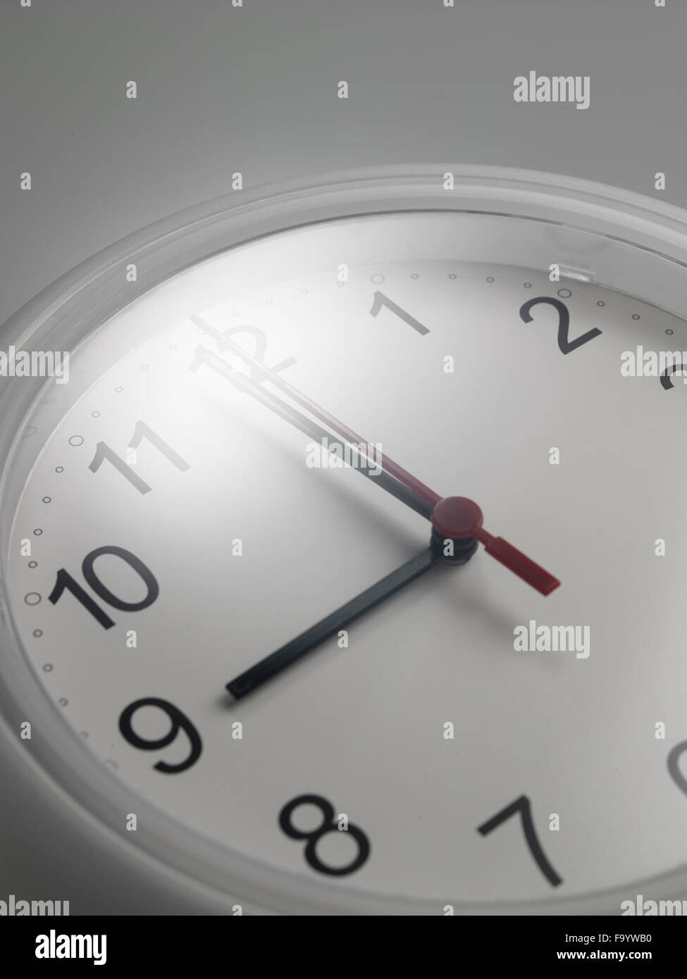 Close up of an analog clock at 9 o'clock Stock Photo - Alamy