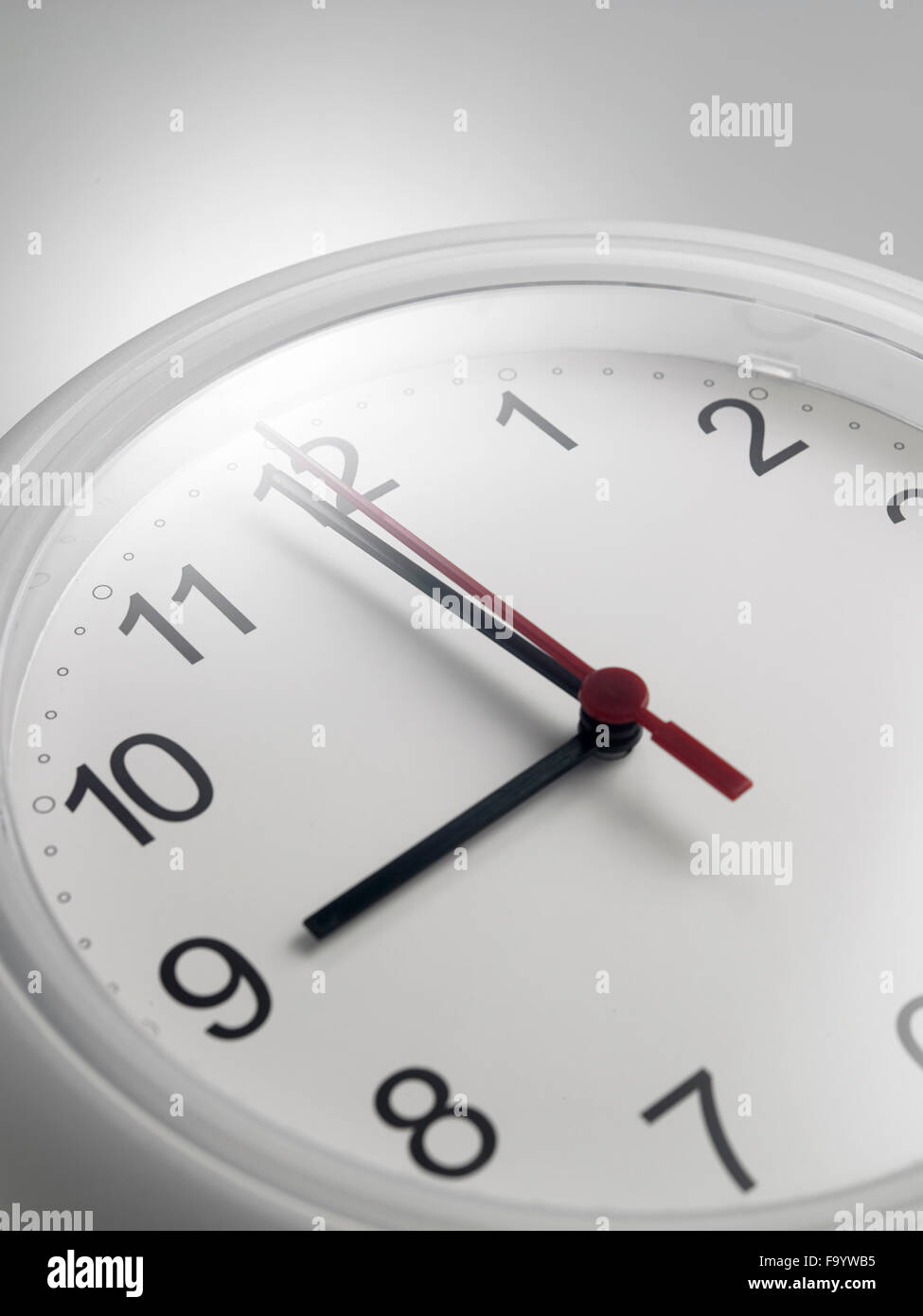 Close up of an analog clock at 9 o'clock Stock Photo - Alamy