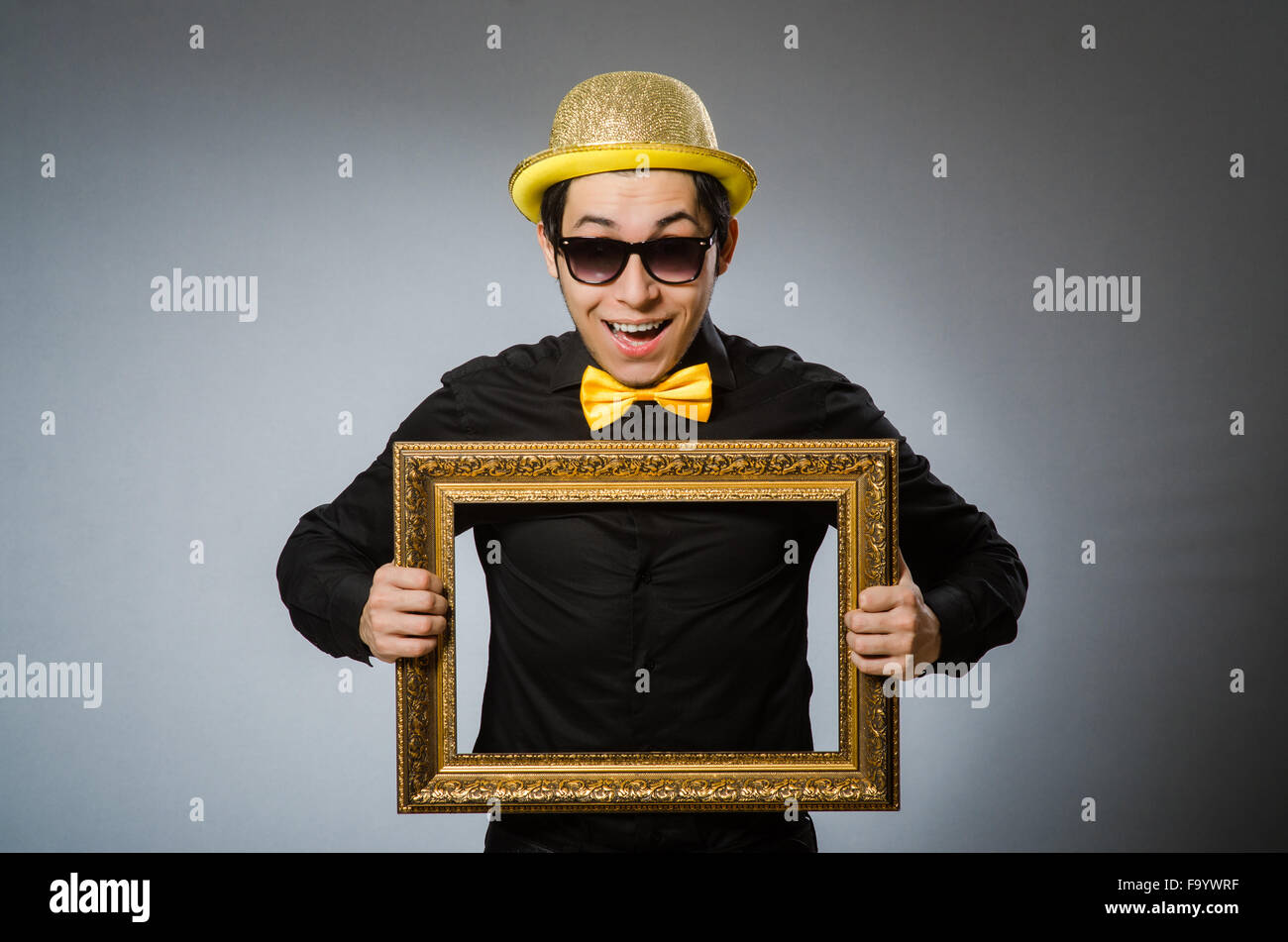 Funny man with picture frame Stock Photo - Alamy