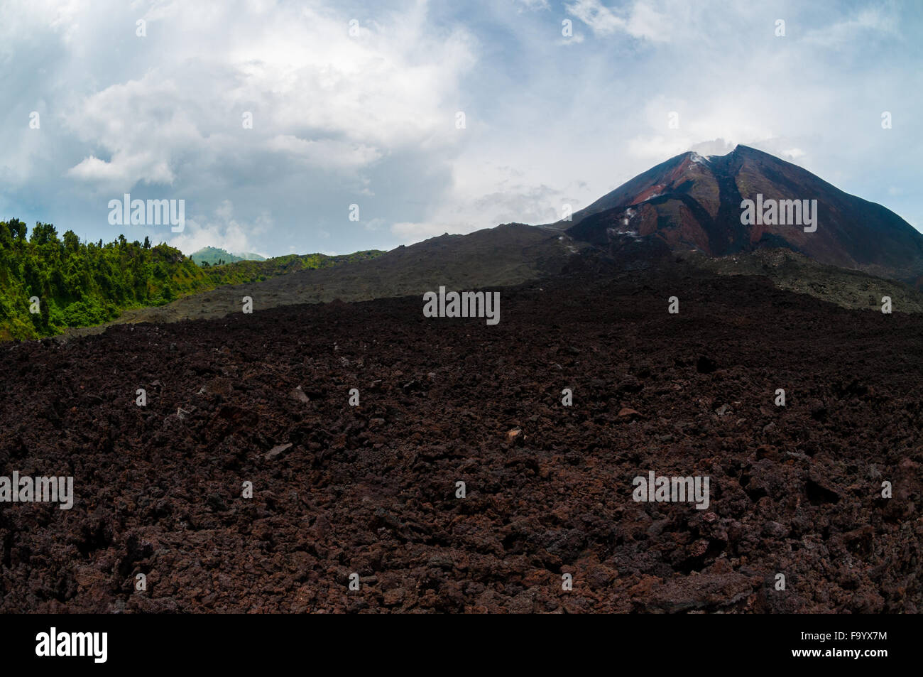 Cold lava residual in front of not active volcano near Antigua Stock ...