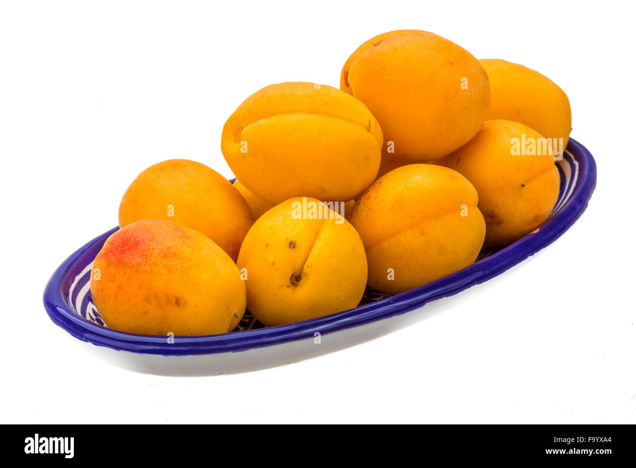 Yellow ripe apricots isolated Stock Photo - Alamy