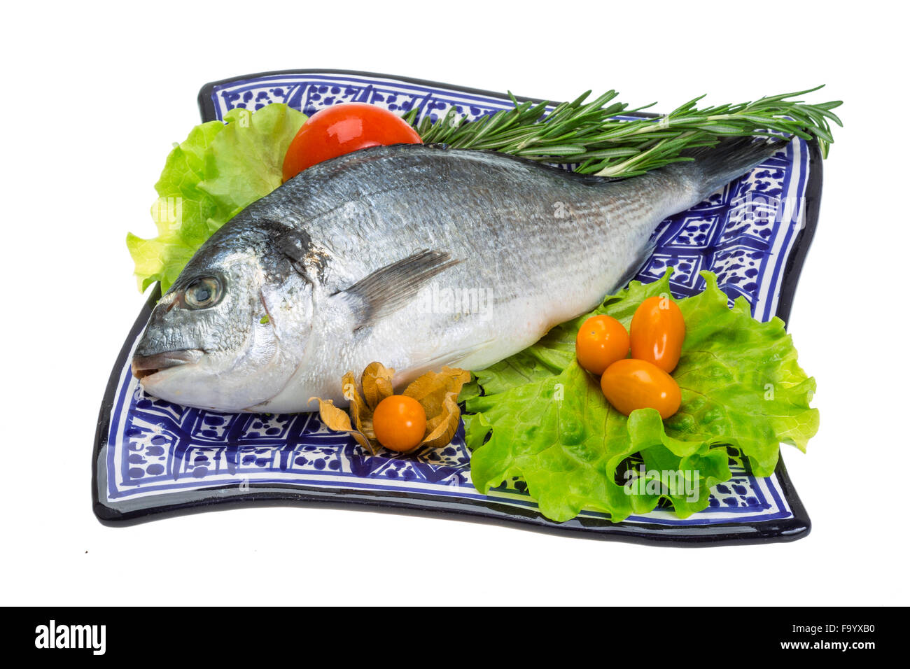 Raw dorado with herbs Stock Photo - Alamy
