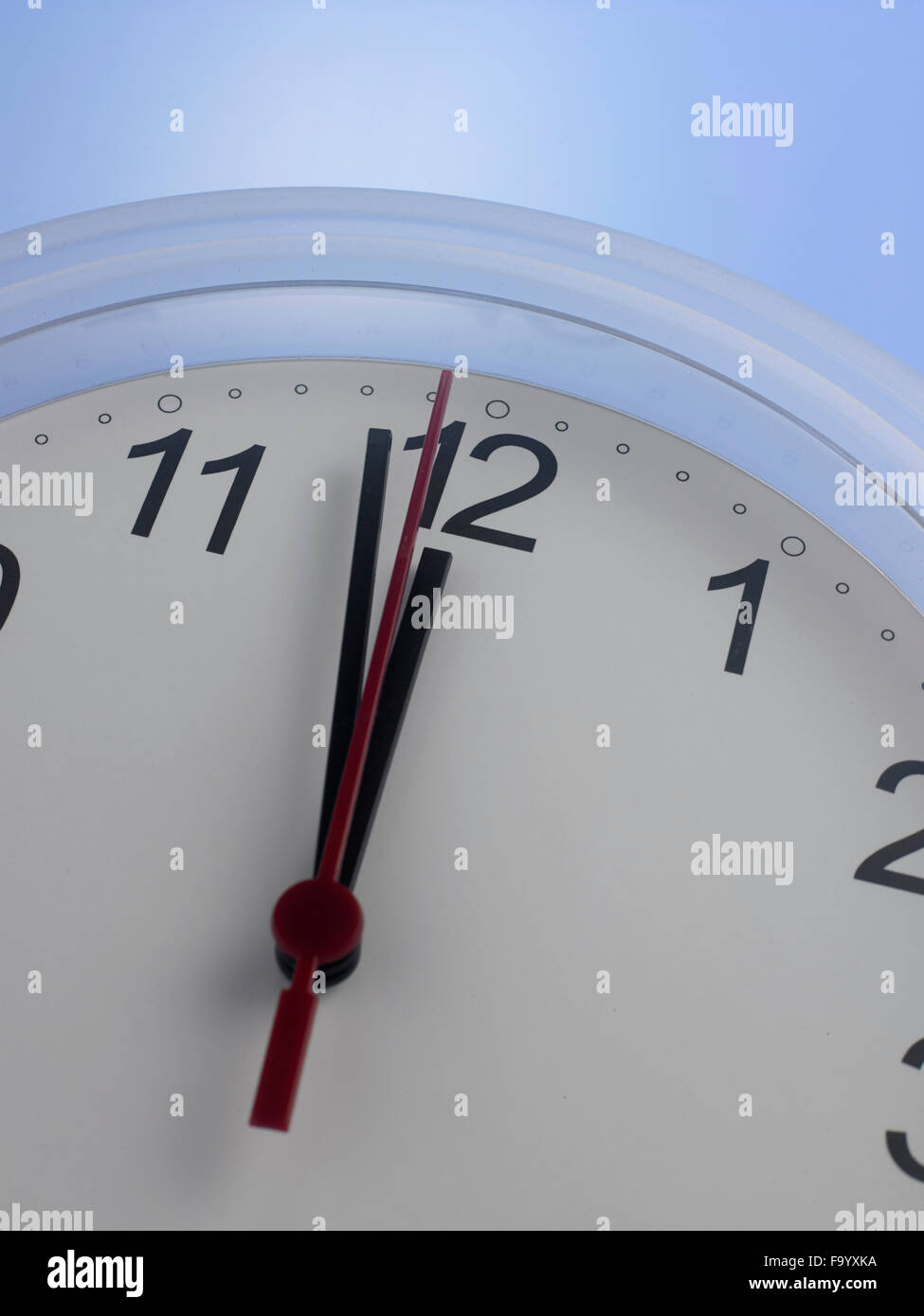 Time shows One Minute to 12 Stock Photo - Alamy