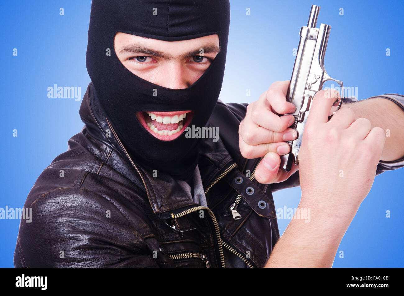 Young thug with gun isolated on white Stock Photo - Alamy