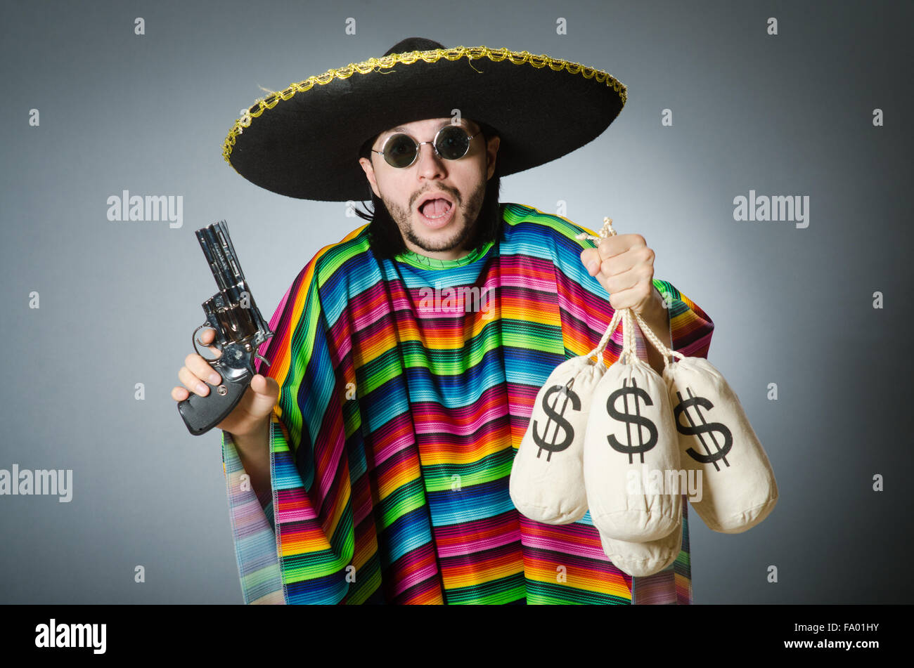 Man with gun and money sacks Stock Photo - Alamy