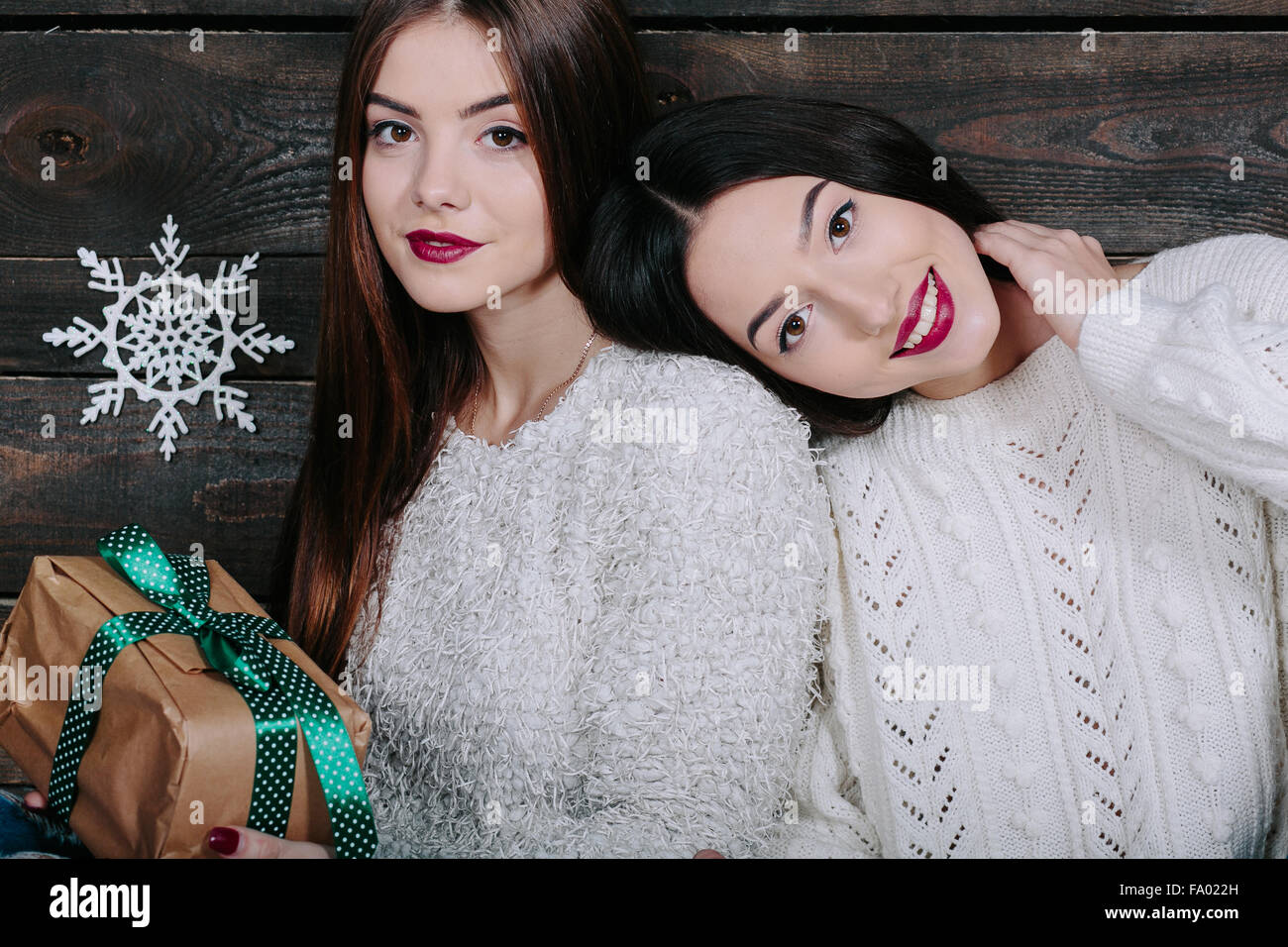 portrait of two beautiful girls at Christmas Stock Photo - Alamy