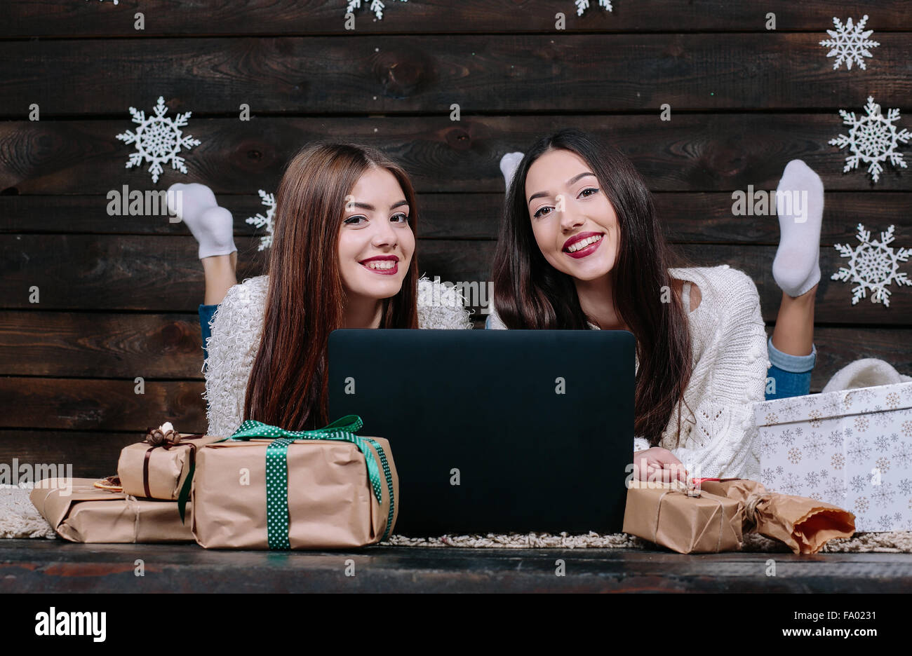 Two beautiful girls lie on the floor Stock Photo - Alamy