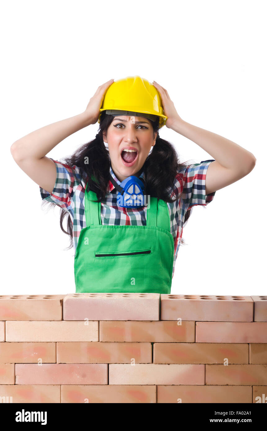Angry female construction worker on white Stock Photo - Alamy