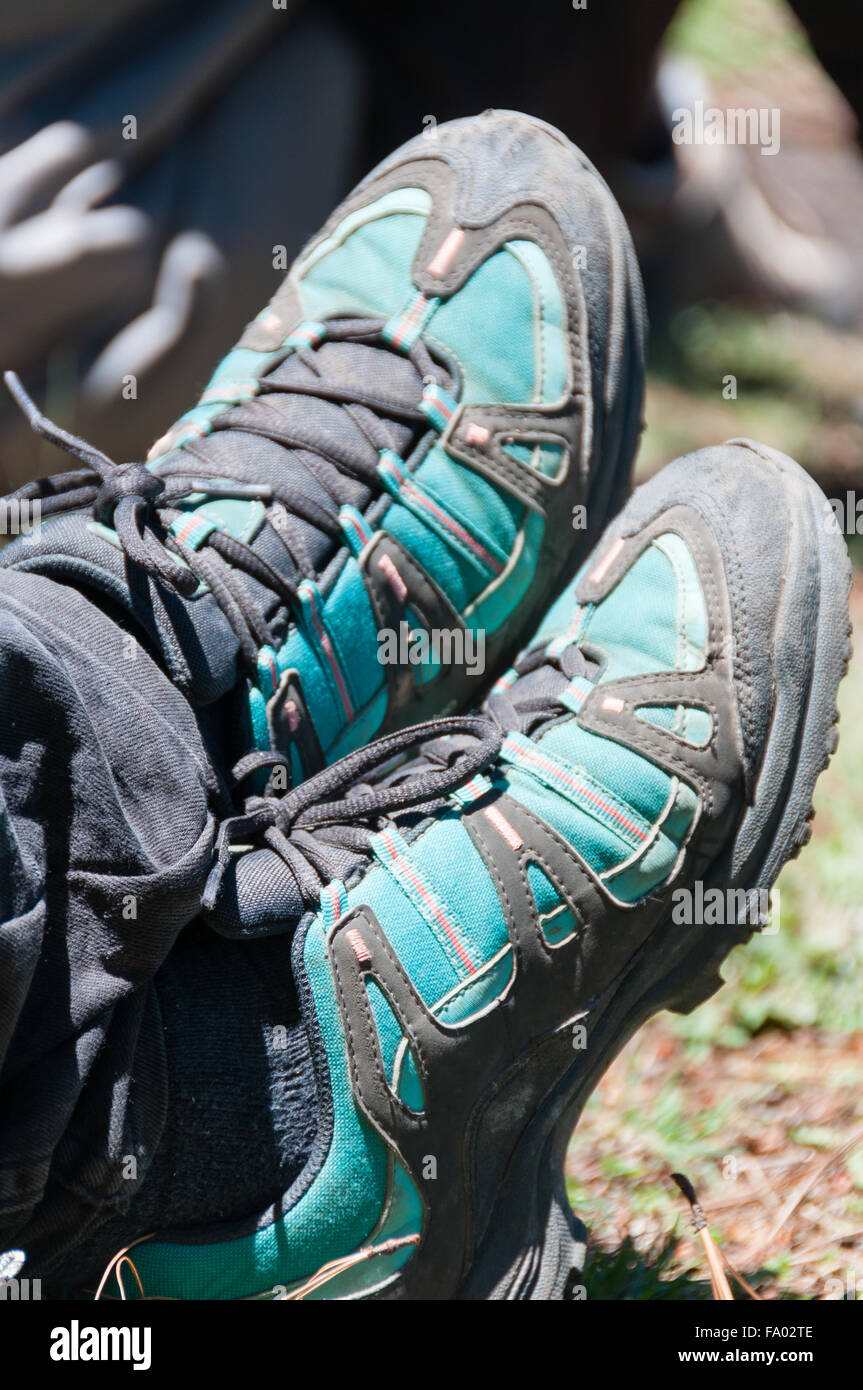 Blue and Grey Rubber hiking Shoes on top of each other in the sun Stock ...