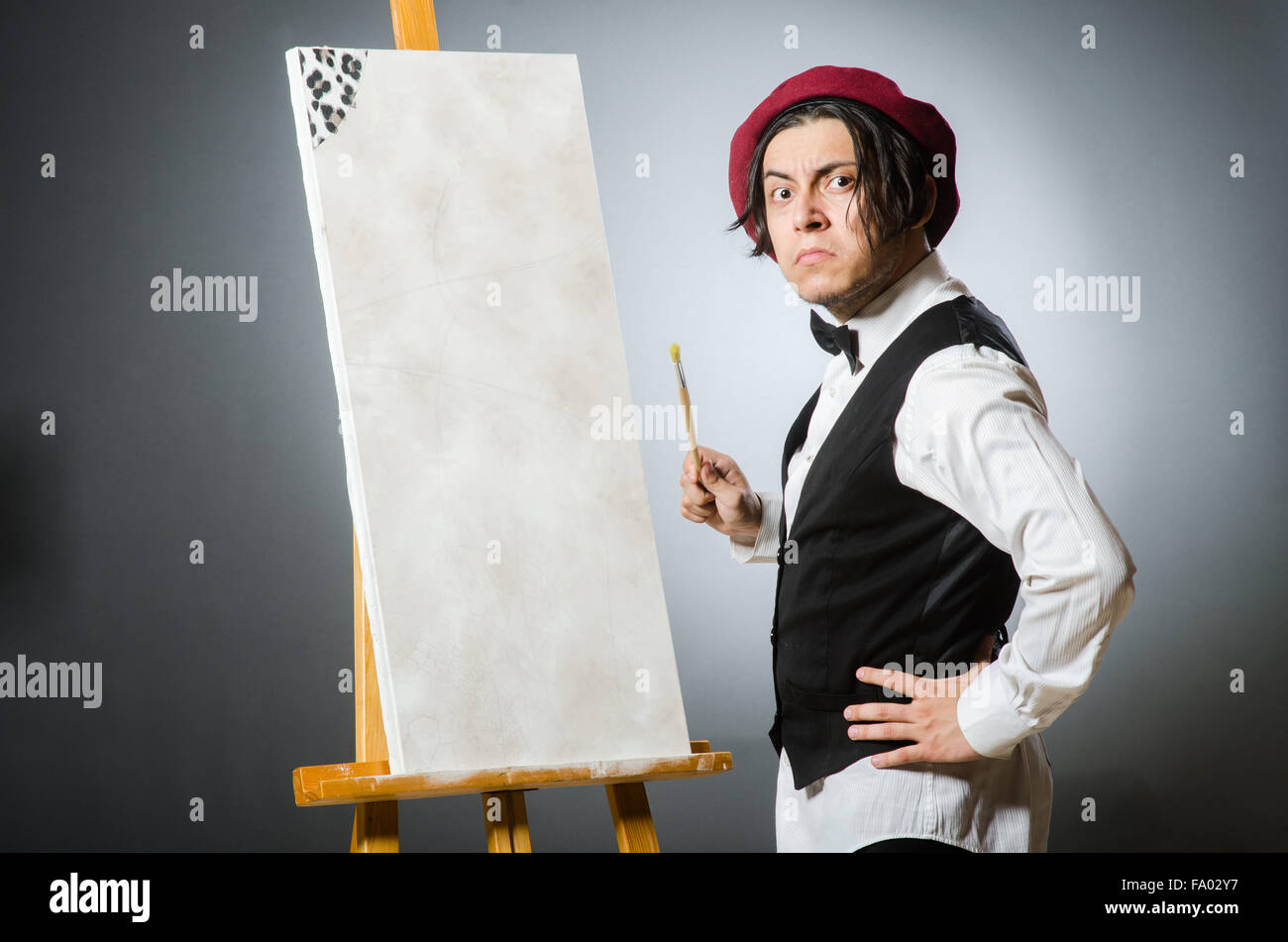 Funny artist in dark studio Stock Photo - Alamy