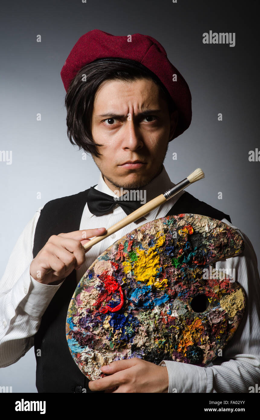 Funny artist in dark studio Stock Photo - Alamy