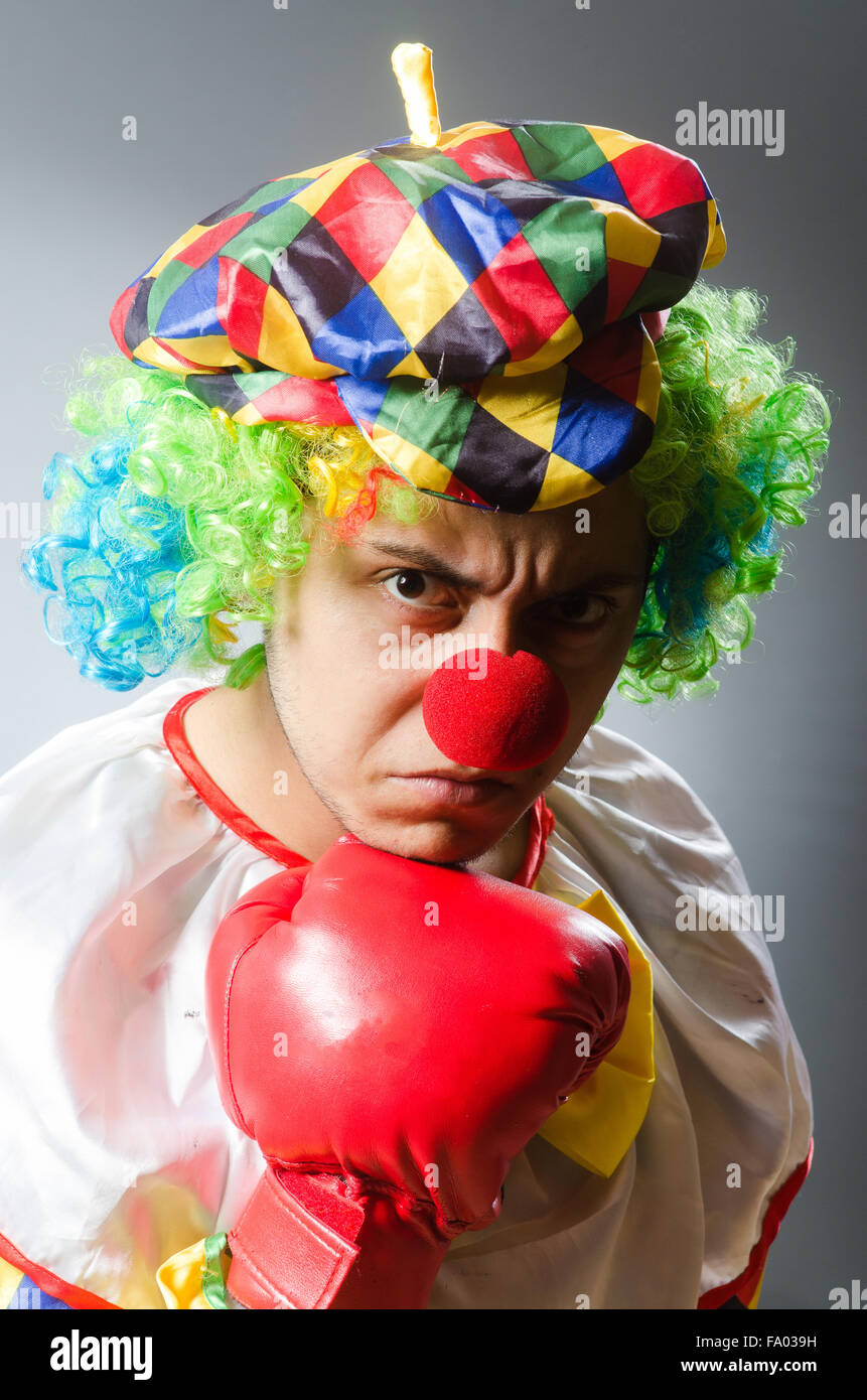 Clown with boxing gloves isolated on white Stock Photo - Alamy