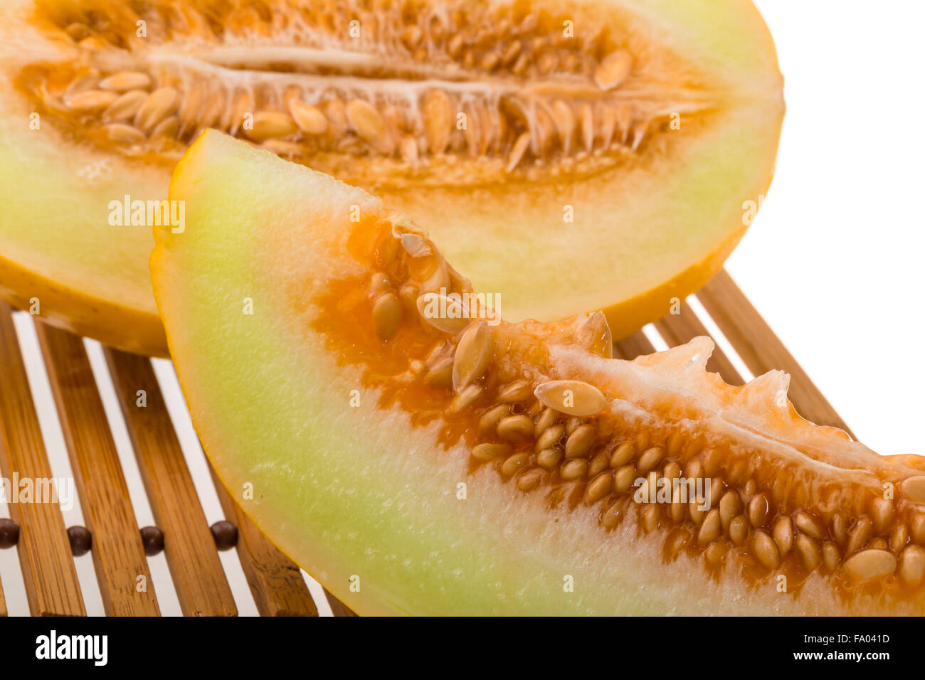 Pipe juicy melon slised macro shoot Stock Photo - Alamy