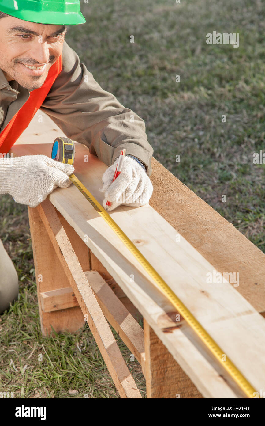 close-up of construction worker hands measuring Stock Photo - Alamy
