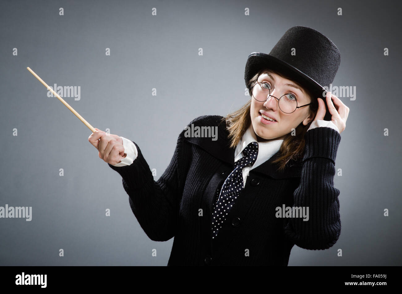 Harry Potter girl with magic stick against gray Stock Photo - Alamy