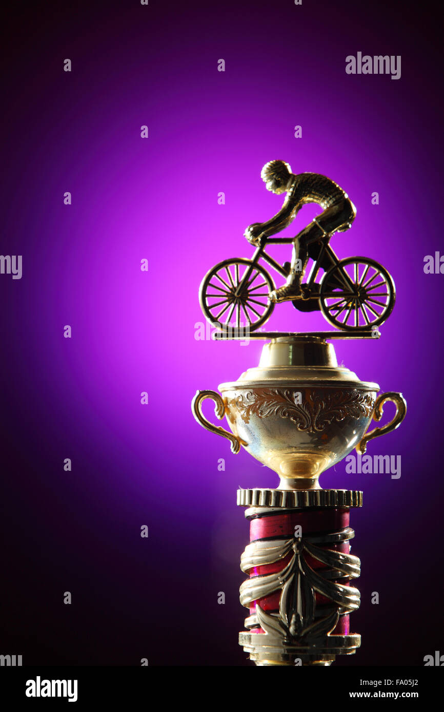 golden trophy on the purple background Stock Photo - Alamy