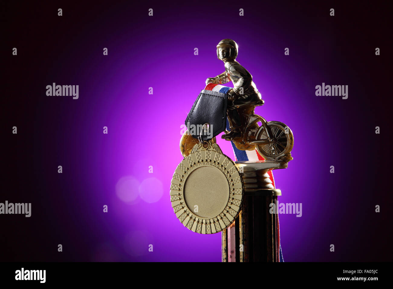 golden trophy on the purple background Stock Photo - Alamy