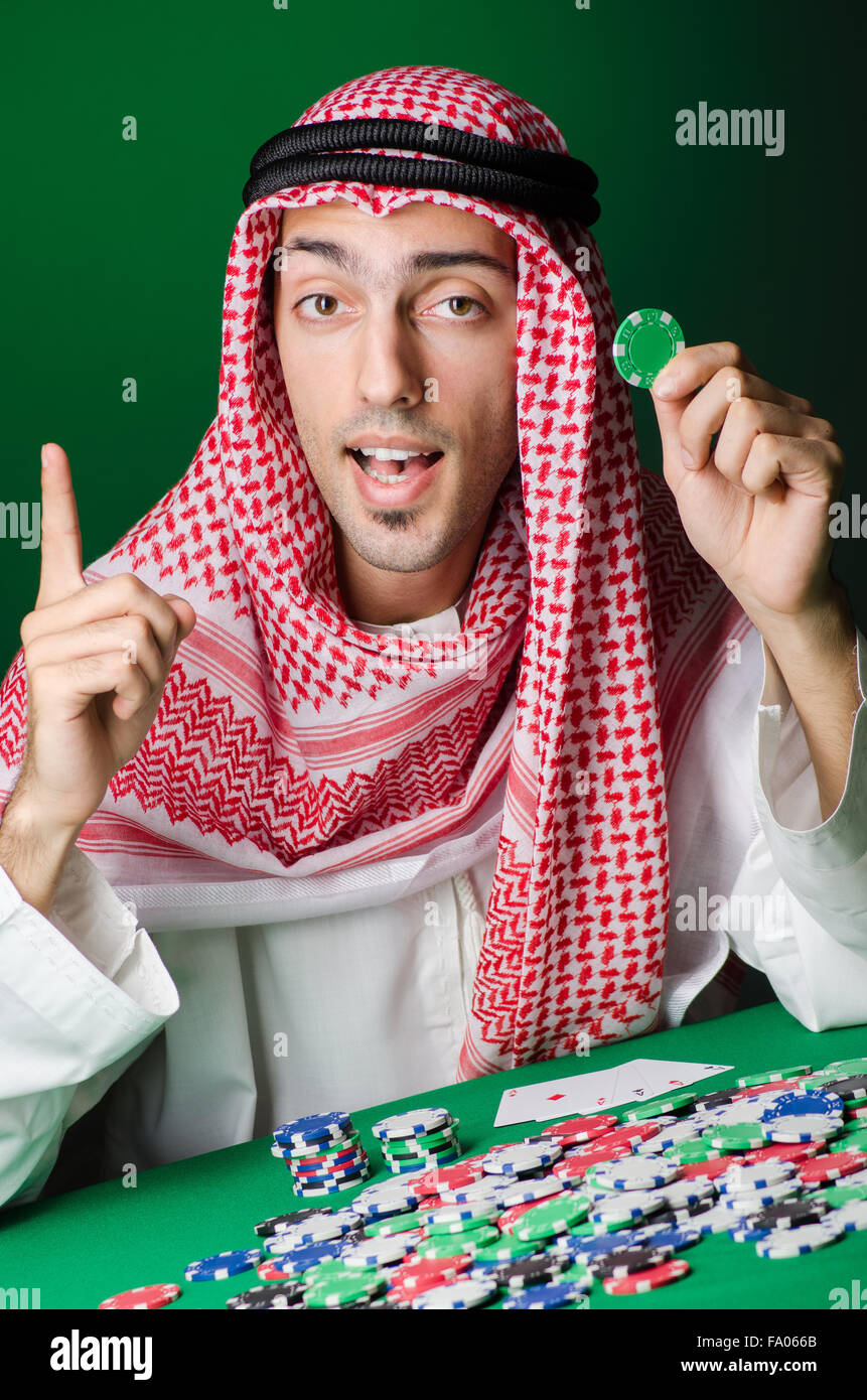 Arab man playing in the casino Stock Photo - Alamy