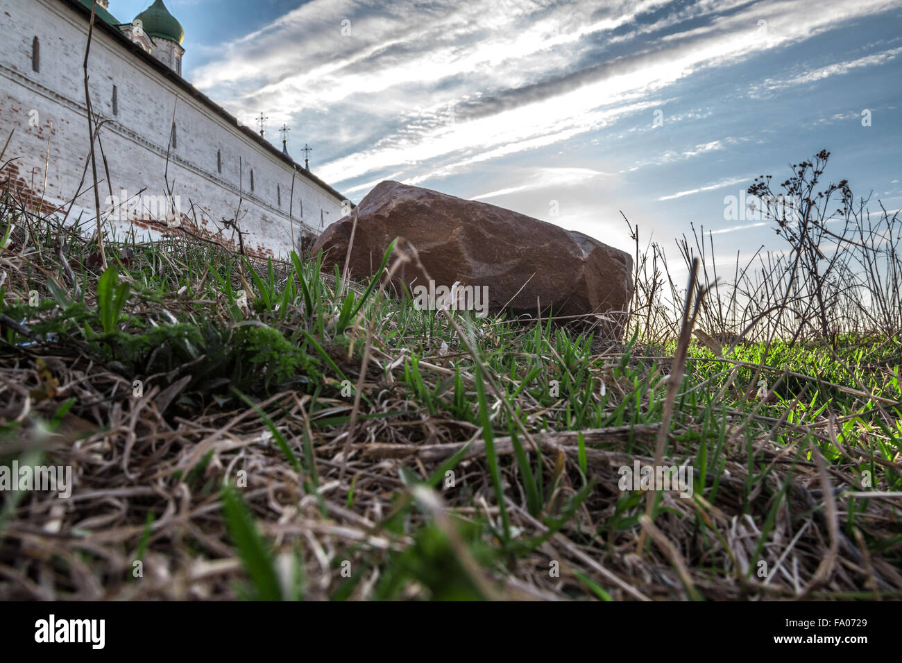 The brown granite stone lies at walls of the old Christian monastery ...
